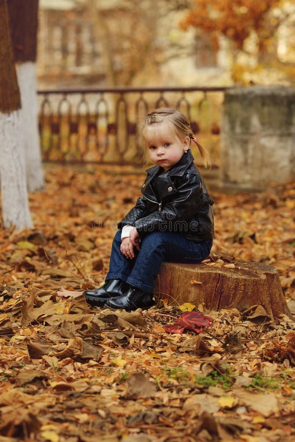 Toddler girl in fall stock photo. Image of leather, autumn - 164615488