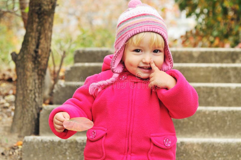 Toddler Girl Pointing Her Nose Stock Photo - Image of bright, fall ...