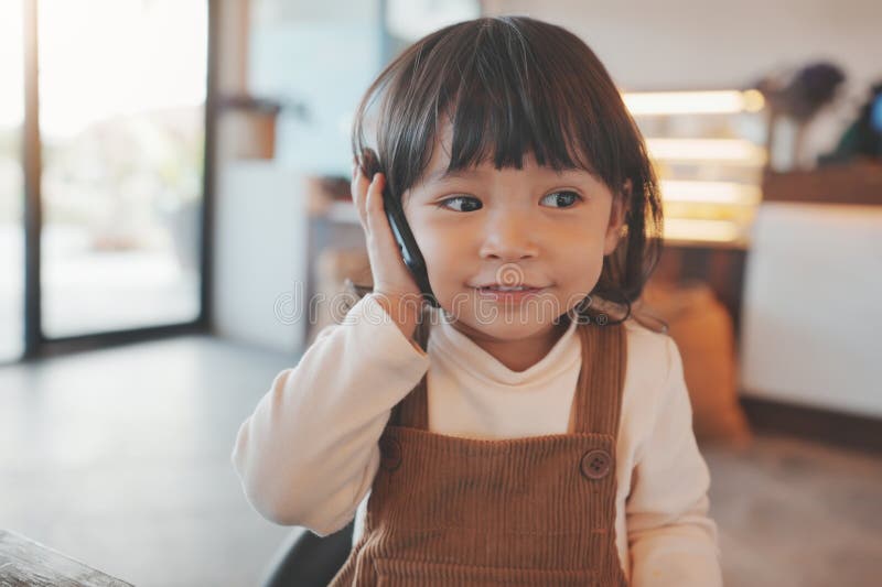 Toddler Girl Talking with Smartphone at Cafe Stock Image - Image of ...