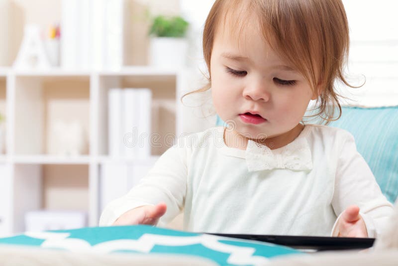 Toddler Girl Watching Her Tablet Computer Stock Image - Image of ...