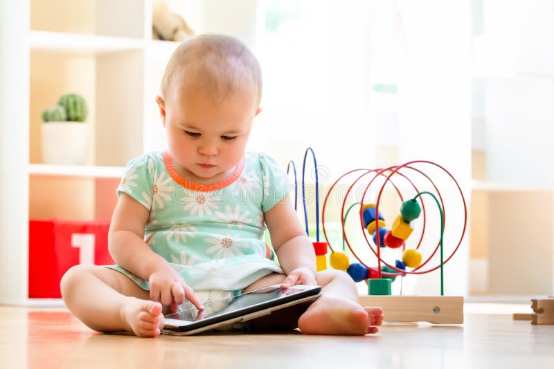 Toddler Girl Watching a Tablet Computer Stock Image - Image of asian ...