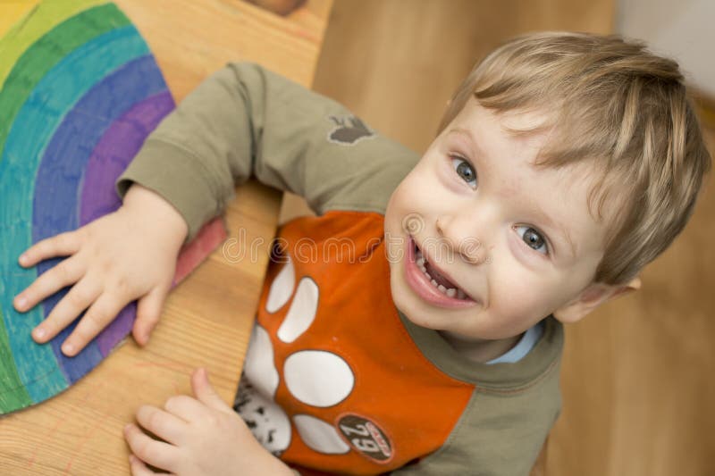 Toddler Inserting Piece of Heart Shape Rainbow Puzzle. Stock Photo ... Toddler Inserting Piece of Heart Shape Rainbow Puzzle. Stock Photo ...