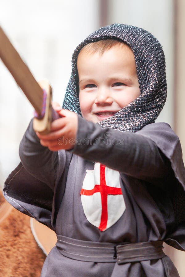 Toddler in Knight Costume with Big Smile Playing with Sword. Stock ...