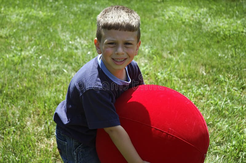Toddler Lifting Ball stock photo. Image of child, heavy - 17398
