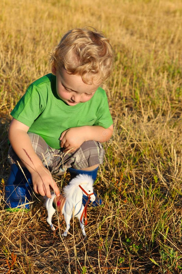 Toddler outdoors stock image. Image of eating, green - 36300999