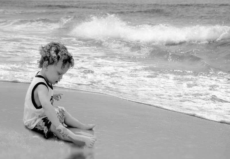 Toddler Playing at Beach stock photo. Image of natural - 5535346