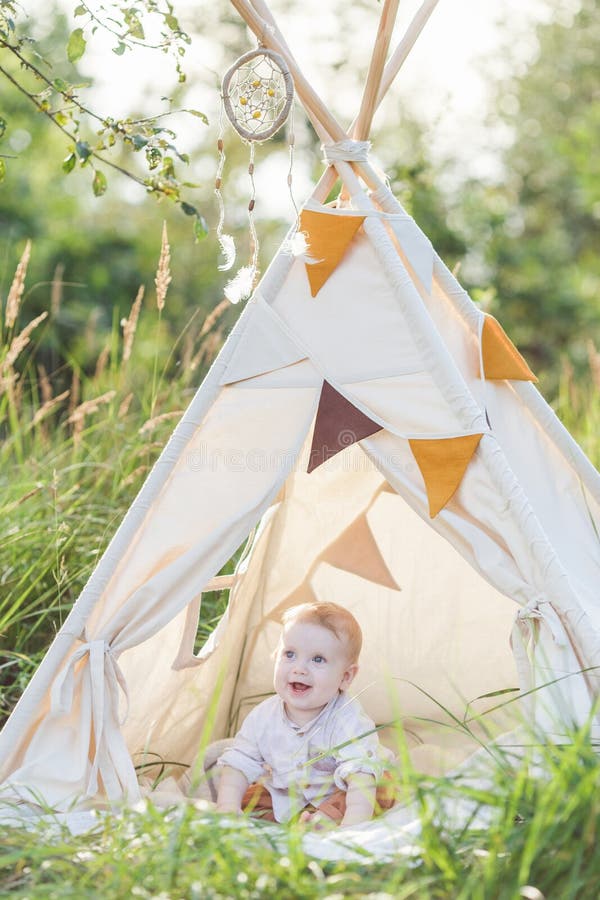 One Year Cute Boy in a Teepee Outdoors. Stock Image - Image of light ...