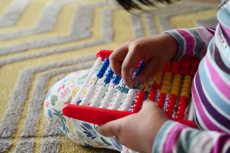 Toddler Playing with Counting Math Learning Toy . Stock Image - Image ...