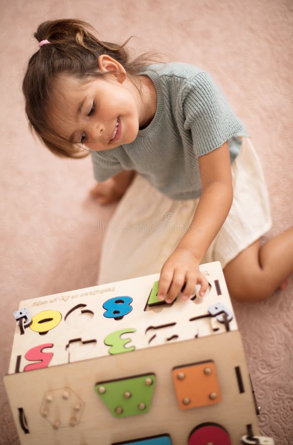 Little Girl Playing Interactive Games for Good Development at Home ...