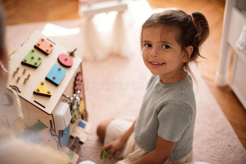 Toddler Playing Interactive Games for Good Development. Stock Image ...