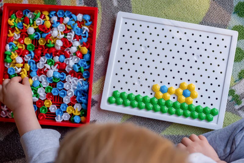 Toddler Playing Pegboard Mosaic. Early Child Development. Fine Motor ...