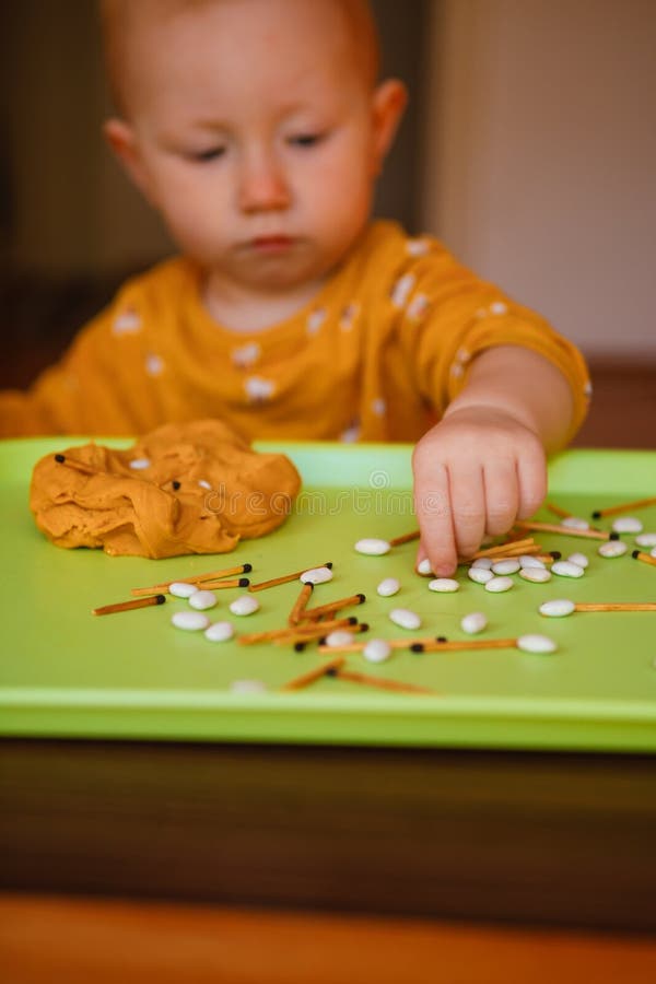 Toddler Plays with Modeling Dough with Small Objects. Stock Image ...