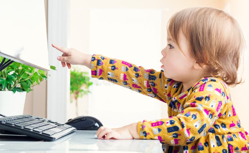 Toddler Pointing To Her Computer Screen Stock Image - Image of play ...