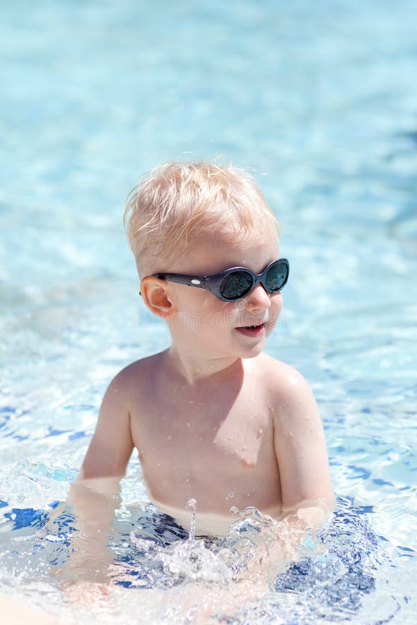 Toddler in a pool stock image. Image of happiness, childhood - 21188809