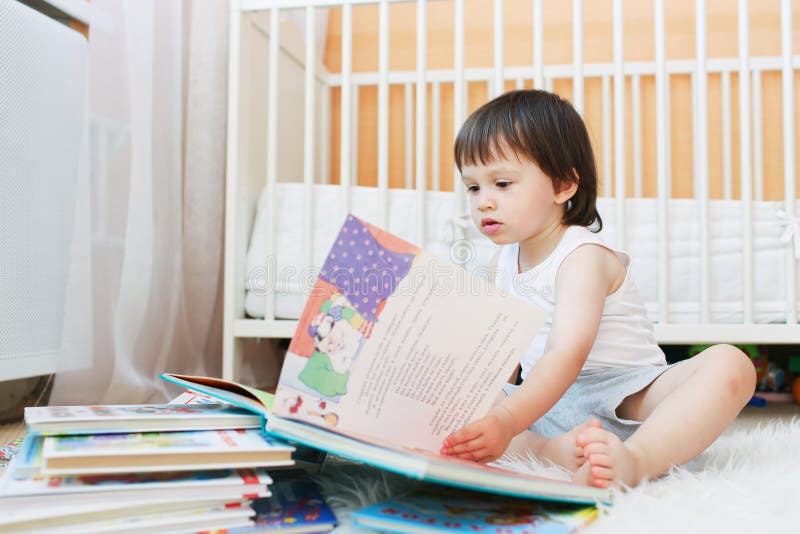 Toddler Reading a Book stock photo. Image of informal - 1777428