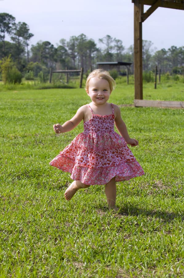 Toddler running outdoors stock photo. Image of lifestyle - 9844510