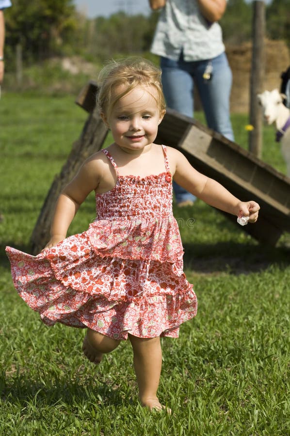 Happy Toddler Running with Balloons in Field Stock Photo - Image of ...