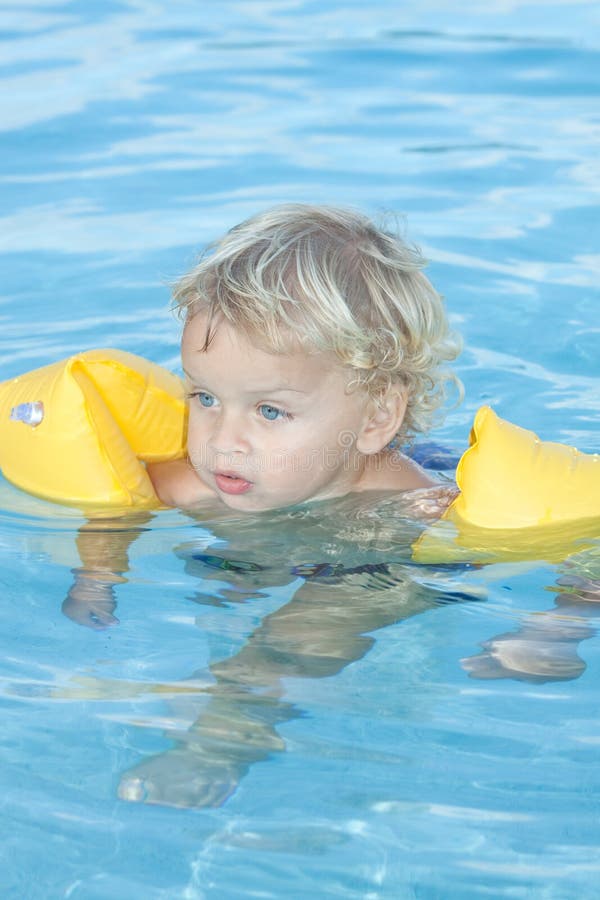 Baby girl in swimming pool stock photo. Image of sunny - 2965142