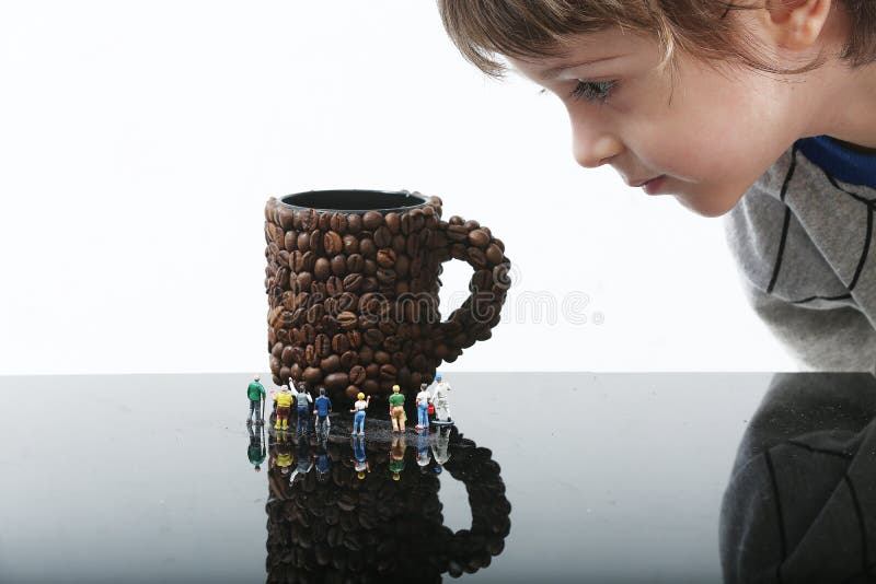 Toddler Watching Miniature People Breaking an Egg Stock Image - Image ...