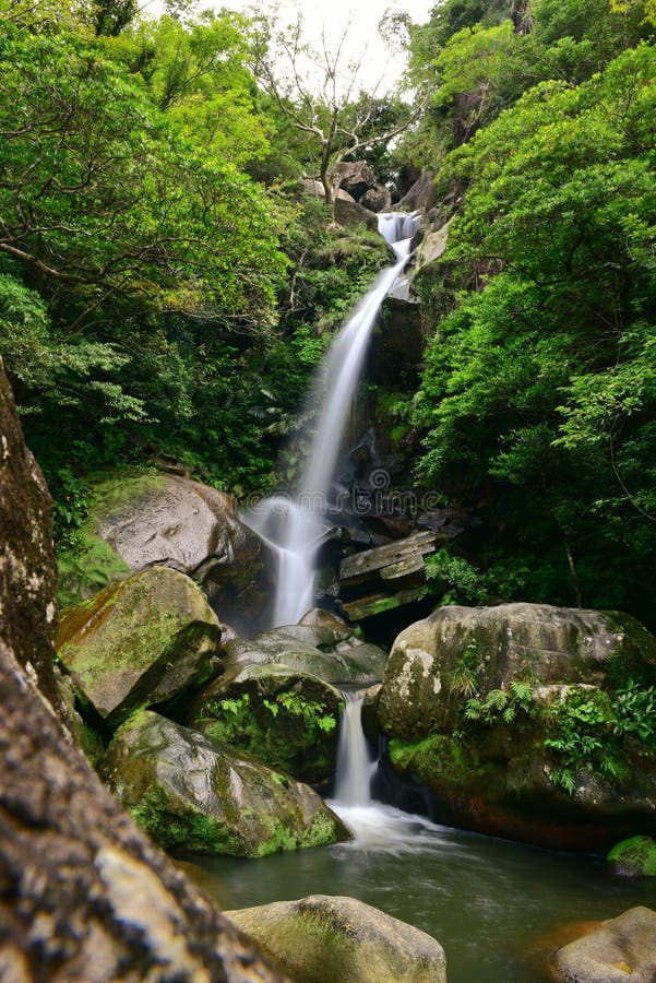 Todoroki falls in Okinawa stock image. Image of tropical - 76906611