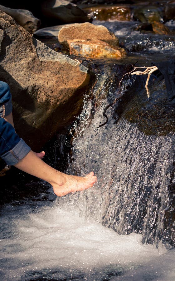 Toe in a cold waterfall stock image. Image of smokey - 78213337