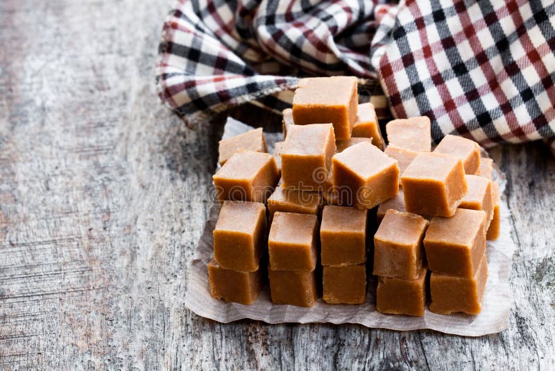 Toffee Cubes on Wooden Table Stock Photo - Image of cooking, powder ...