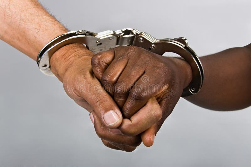 Two People Handcuffed Together Stock Photo - Image of pair, prisoner ...