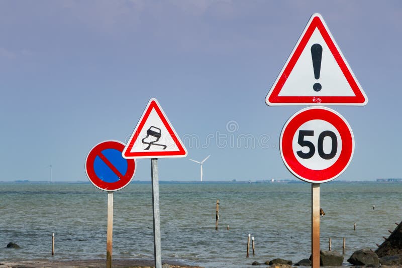 Together of Road Signs Next To Sea Stock Photo - Image of dangerous ...