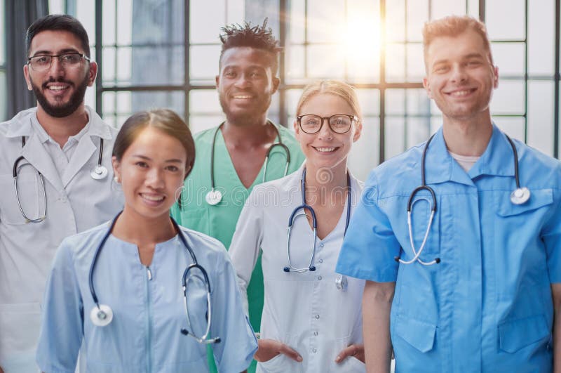 Professional Multinational Doctors Camera Posing. Teamwork Connection ...
