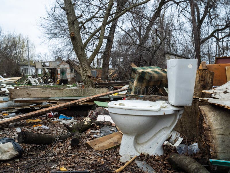 The Toilet Bowl Left on a Dump. a Dump among the Destroyed Buildings ...