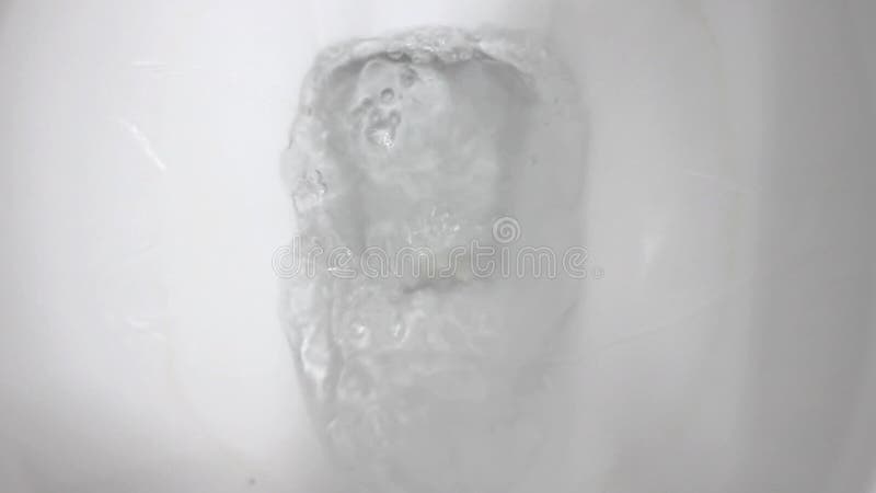 Toilet Flushed Top Down View. Water and Paper Flushing Down into Toilet ...