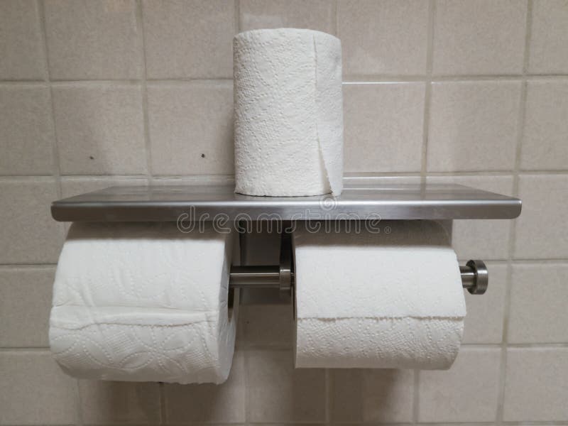 Toilet paper on a rack stock photo. Image of paper, lighting - 256769516