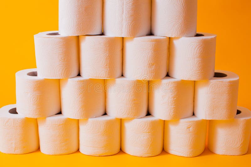Toilet Paper Rolls As a Wall Background Pattern Over Yellow Stock Photo ...