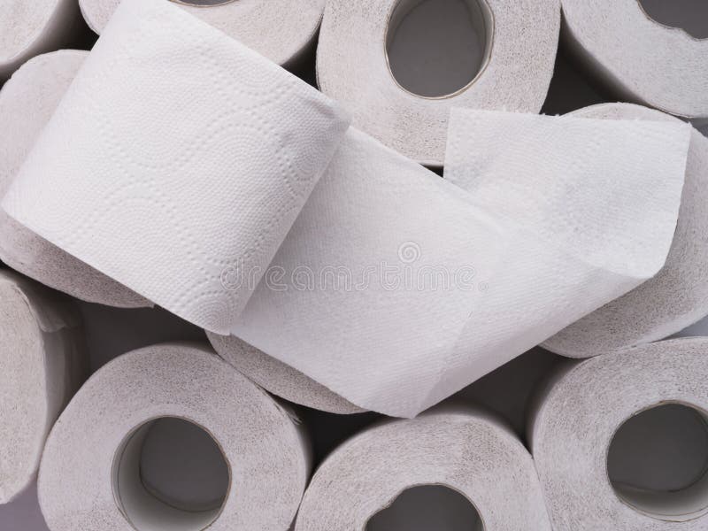A Toilet Roll Lying on Top of Heap of Toilet Paper Rolls Stock Photo ...