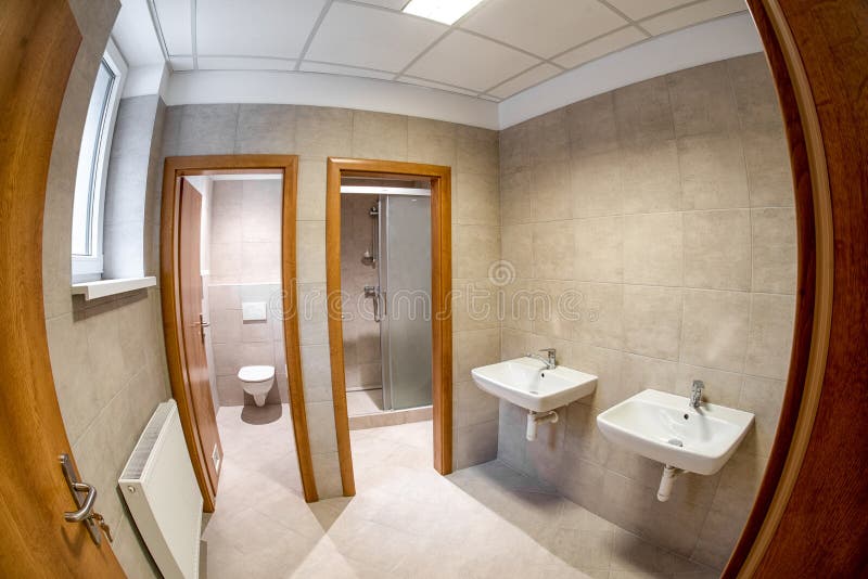 Toilets and Shower in Office Building Stock Image - Image of tiles ...
