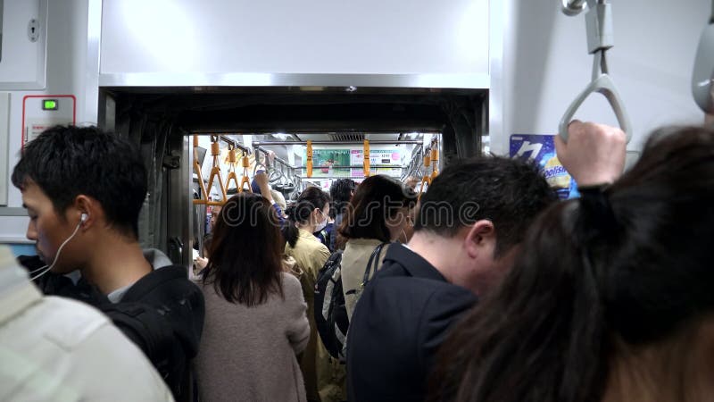 TOKYO, JAPAN - APRIL, 18, 2018: Interior Shot of a Crowded Commuter ...