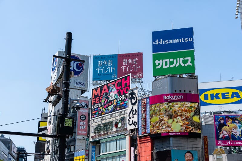 A Vibrant Collage of Billboards Illuminates the Dynamic Streetscape of ...