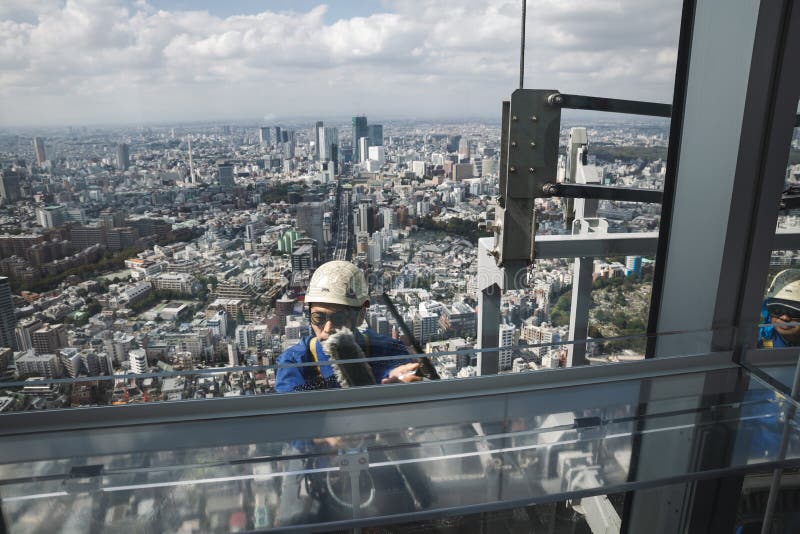Worker Cleaning the Window of the High Building in Tokyo Japan ...