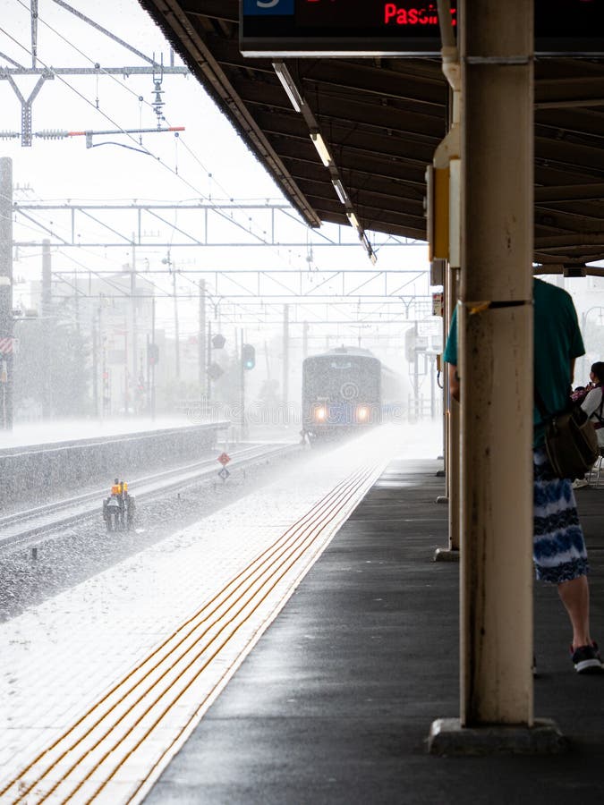 Tokyo, Japan - 27 8 19: a Train Arriving at the Platform in Very Heavy ...