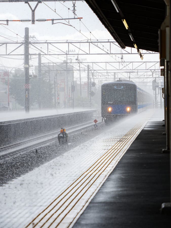 Tokyo, Japan - 27 8 19: a Train Arriving at the Platform in Very Heavy ...