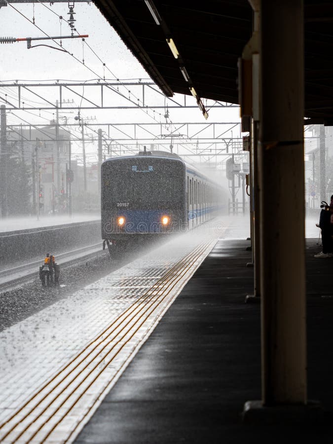 Tokyo, Japan - 27 8 19: a Train Arriving at the Platform in Very Heavy ...