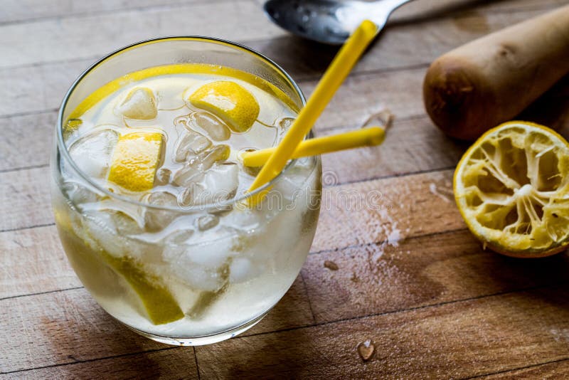 Tom Collins Cocktail with Lemon and Ice. Stock Photo - Image of light ...