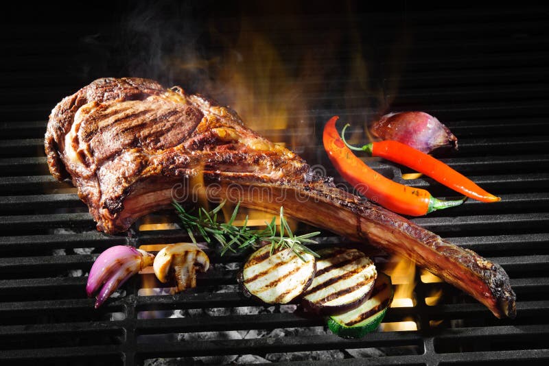 Tomahawk Rib Beef Steak on Grill Stock Image - Image of flames ...