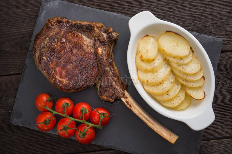 Tomahawk rib steak stock image. Image of bison, grill - 125712951