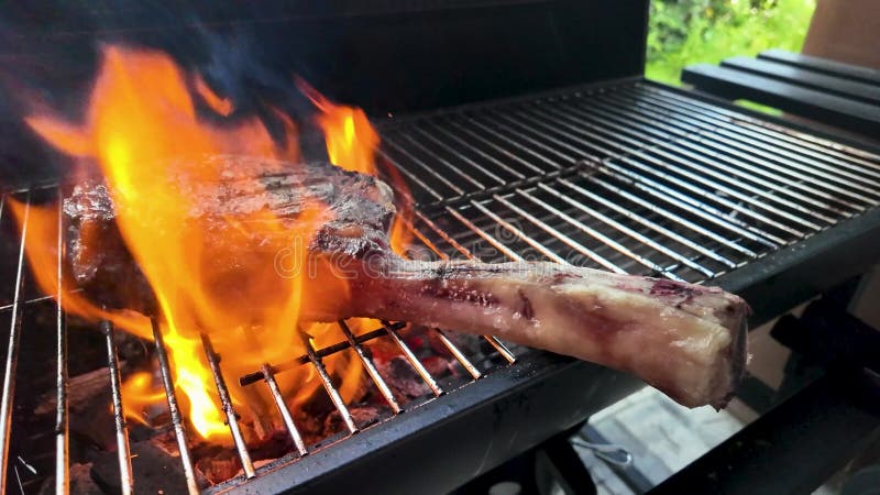 Tomahawk Steak on the Grill with Fire Flames Stock Video - Video of ...