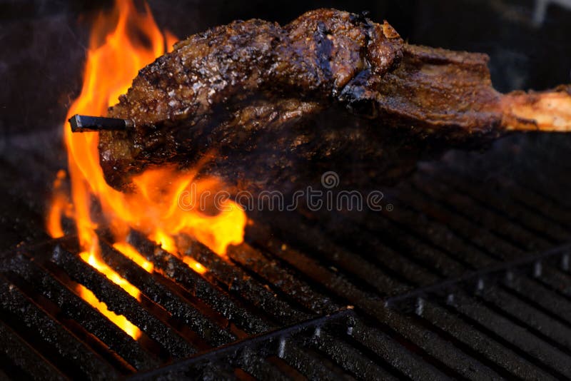 Tomahawk Steak on a Grill Grid on Fire Stock Photo - Image of grilling ...