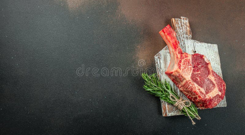 Tomahawk Steak. Raw Beef Meat on a Wooden Board. Long Banner Format ...
