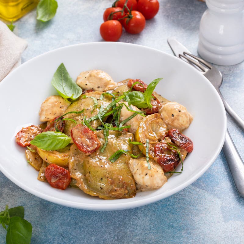 Tomato Basil Ravioli Served with Mozzarella and Basil Stock Image ...