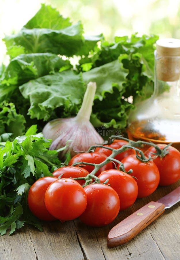 Tomato Cherry , Garlic, Lettuce and Oil Stock Image - Image of lunch ...