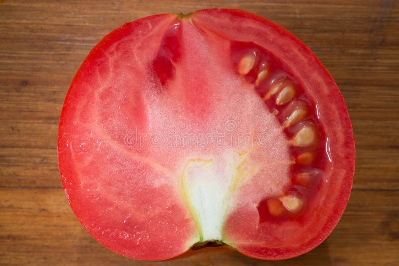Tomato Cut in Half on the Table Macro Photo. Stock Photo - Image of ...